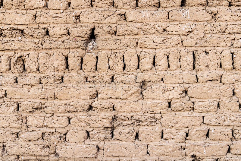 Eroded mud brick wall stock photo. Image of pattern - 258184200