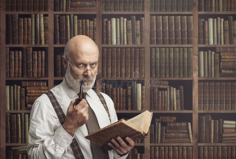 Academic Professor in the Library Holding a Book Stock Photo - Image of ...