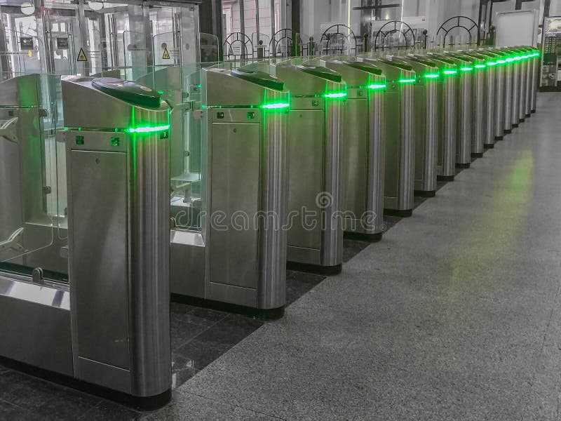 Turnstiles for Passing Passengers on Tickets at the Railway Station ...