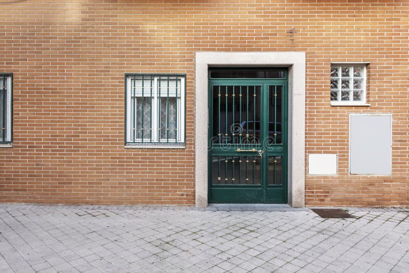 Access Door on the Facade of a Building with a House on the Ground ...