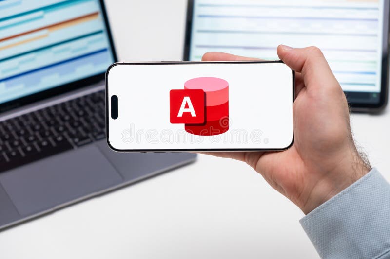 Access Logo on the Screen of a Smartphone in Mans Hand with Laptop and ...