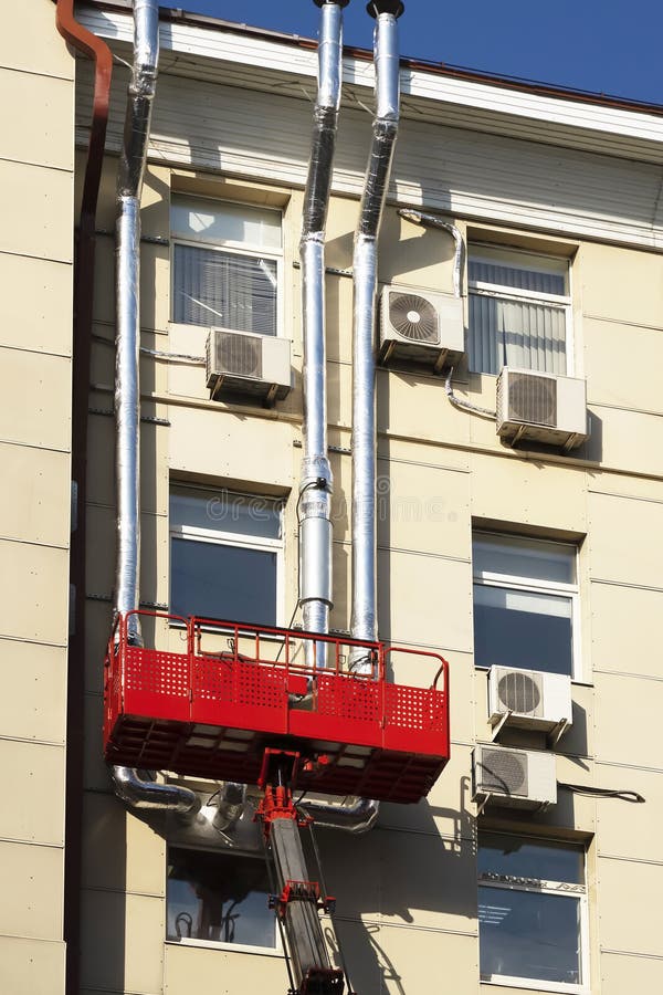 Access Platform Equipment Working High in the Sky at a Construction ...