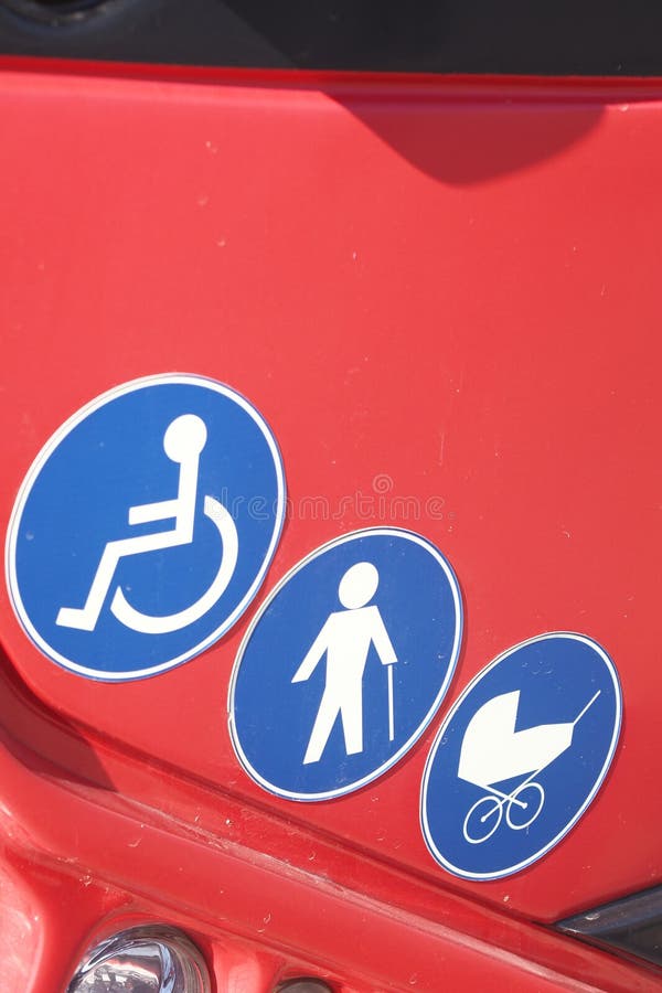 Accessibility Symbols Displayed on a Red Surface for Public Awareness ...
