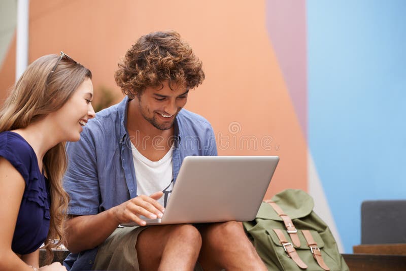 Accessing Their Online Course Work. Two College Students Sitting ...