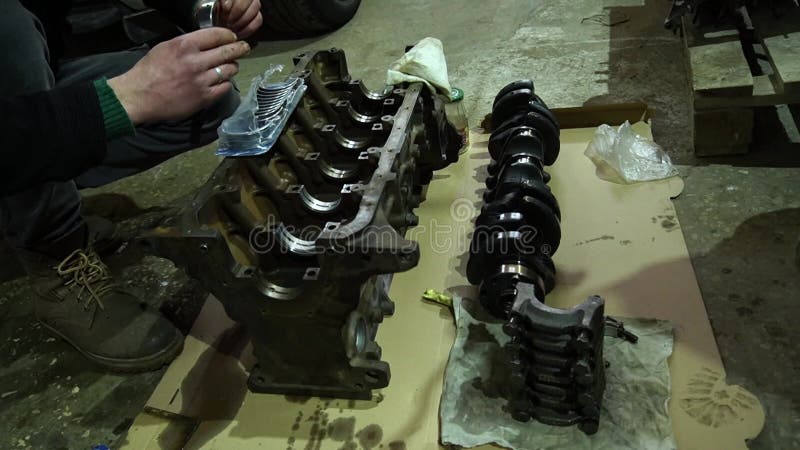 Assembling a Car Engine Installing a Crankshaft in a Cylinder Block ...