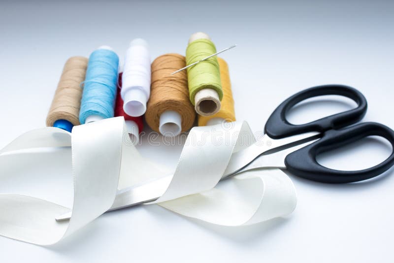 Accessories for Needlework Thread, Tape, Scissors on a White Background ...