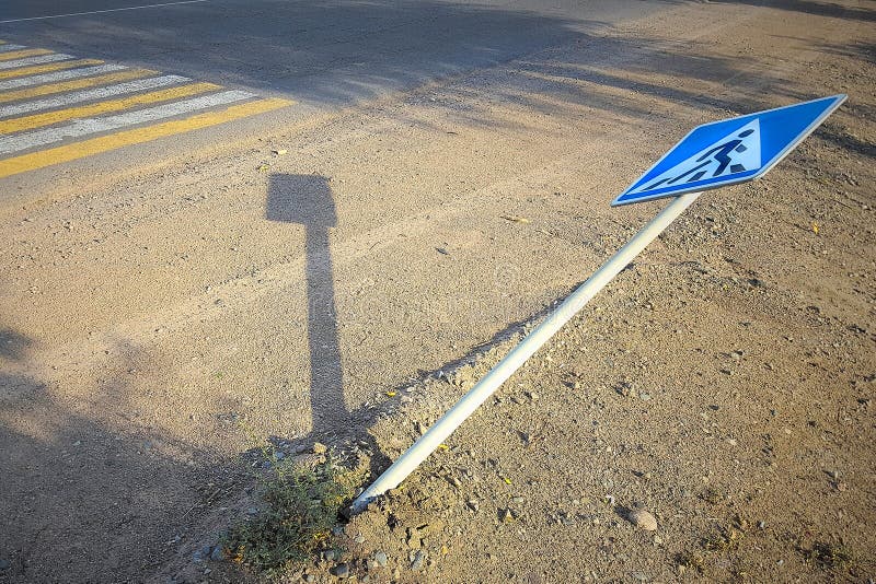 Accident at a Pedestrian Crossing. Downed Pedestrian Crossing Road Sign ...