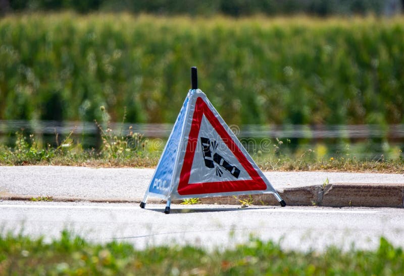 Accident sign on the road stock photo. Image of wind - 254685964