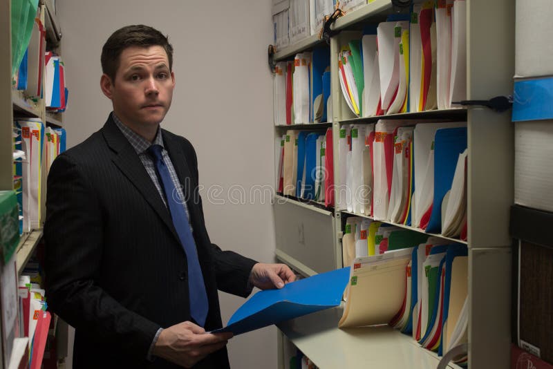 Accountant in File Storage Room Stock Photo - Image of working, office ...