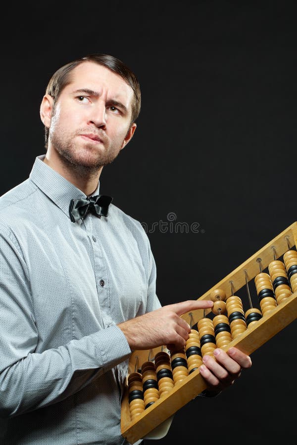 Businessman with abacus stock photo. Image of aggravated - 77350884