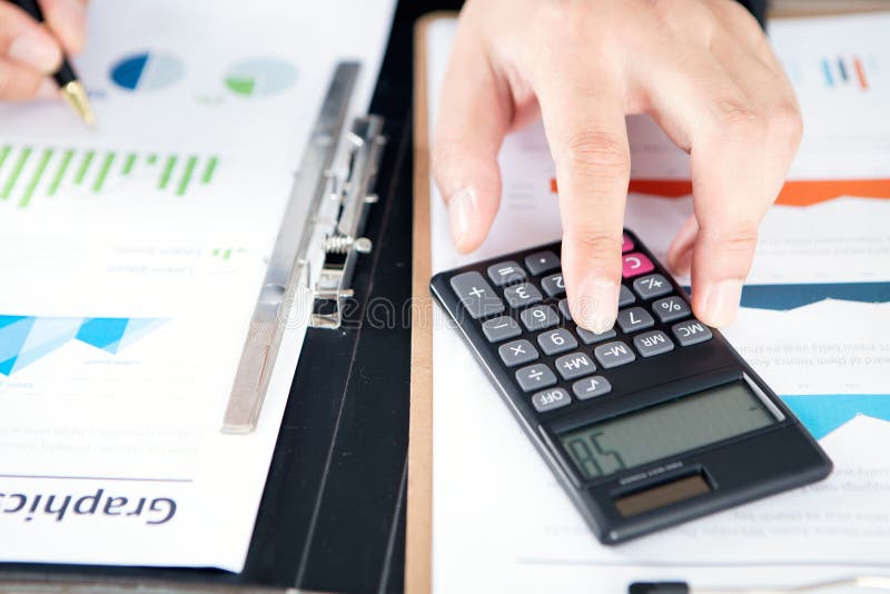 Accountant Using a Calculator for Accounting Stock Photo - Image of ...
