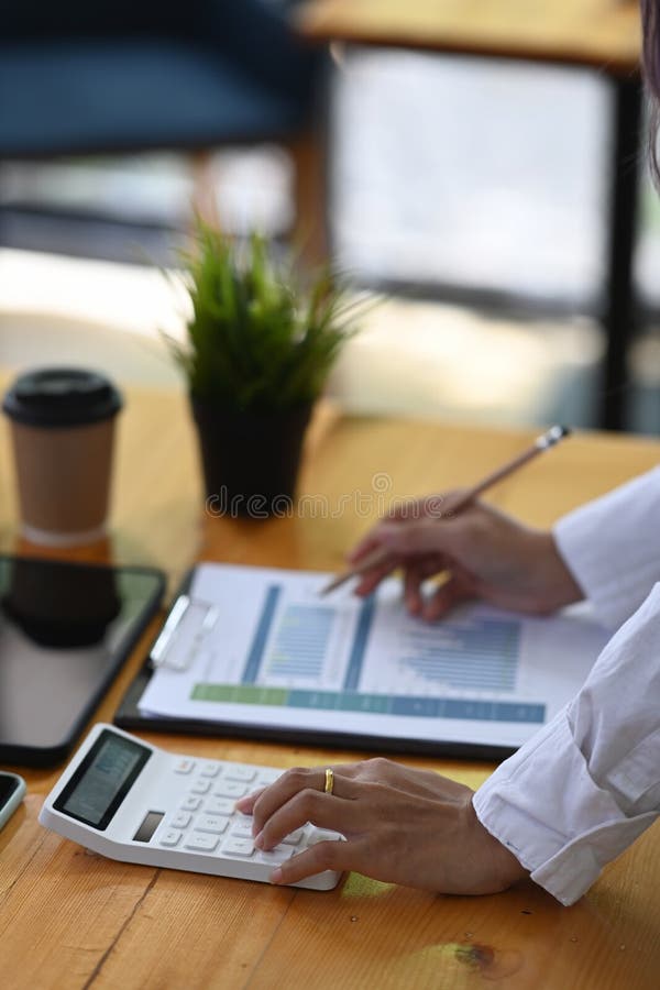 Accountant Using Calculator and Analyzing Financial Graph. Stock Image ...