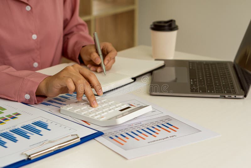 Accountant Using Computer with Clamp and Graph Document, Business Man ...
