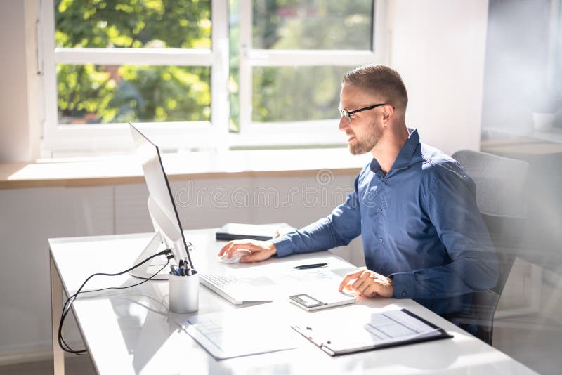 Accountant Using E Invoice Software at Computer Stock Photo - Image of ...