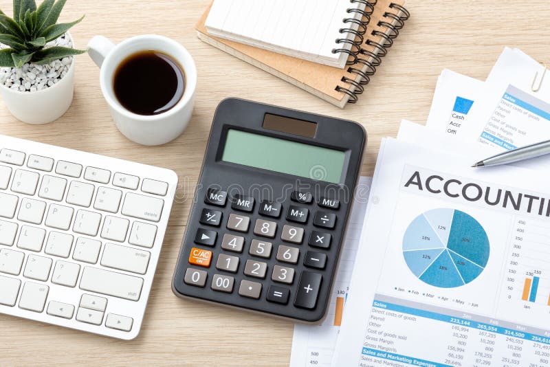 Accounting Concept with Calculator and Accounting Data Chart on Wood ...