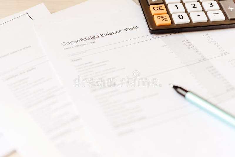 Accounting Documents and a Calculator on the Desktop. Financial Concept ...