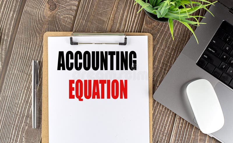 ACCOUNTING EQUATION Text on Clipboard Paper with Laptop, Mouse and Pen ...