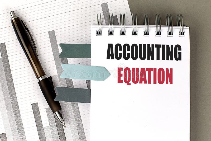 ACCOUNTING EQUATION Text on Notebook with Chart on Gray Background ...