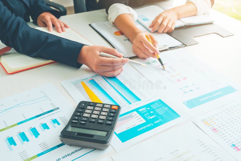 Accounting Officer Team Working and Analysis Data Chart in Office ...