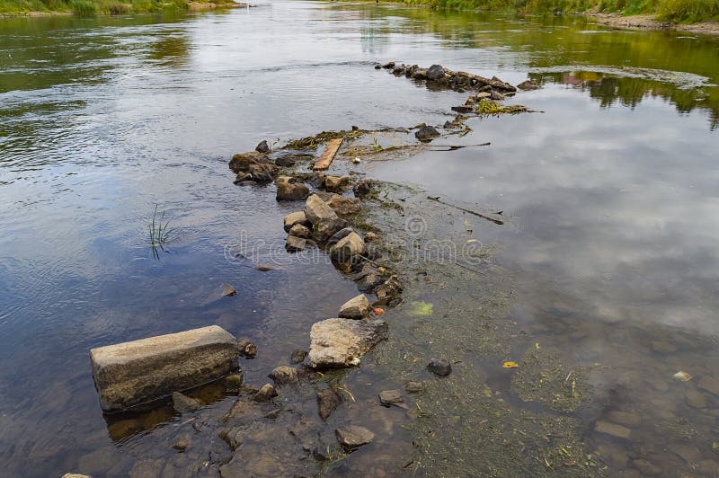 Accumulation of Waste in the River. Garbage and Empty Aluminum Can ...
