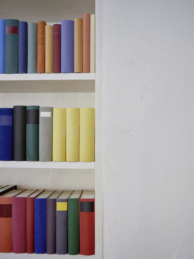 Accurate Bookcase with Colorful Covers in White Wall Stock Image ...