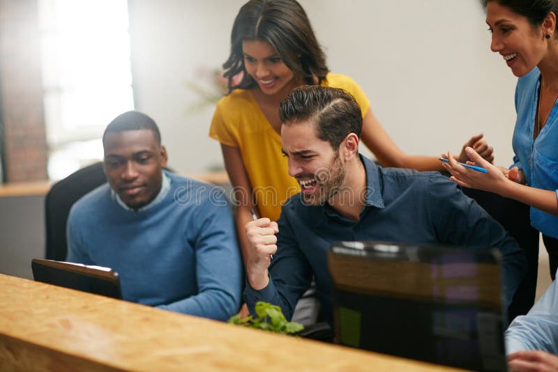 Achieving Success. a Group of Creative Professionals Cheering in the ...