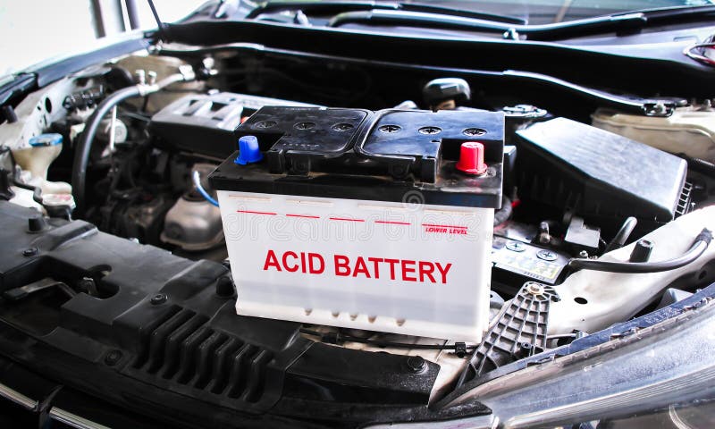 ACID Battery for Car on the Engine Compartment of a Car Stock Image ...