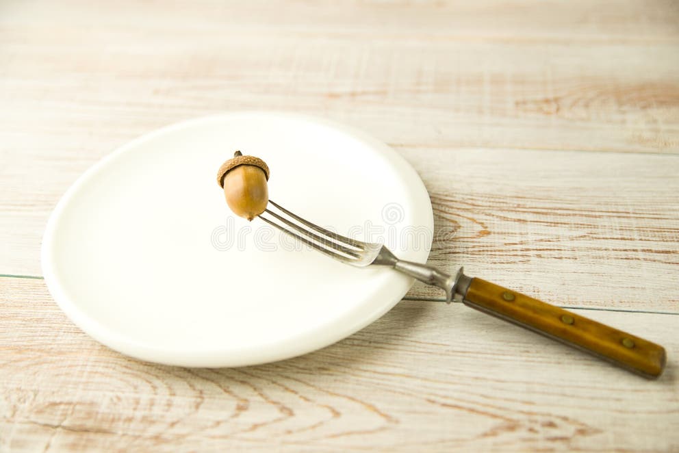 Acorn, Plate and Fork on the Table Stock Photo - Image of food, fork ...