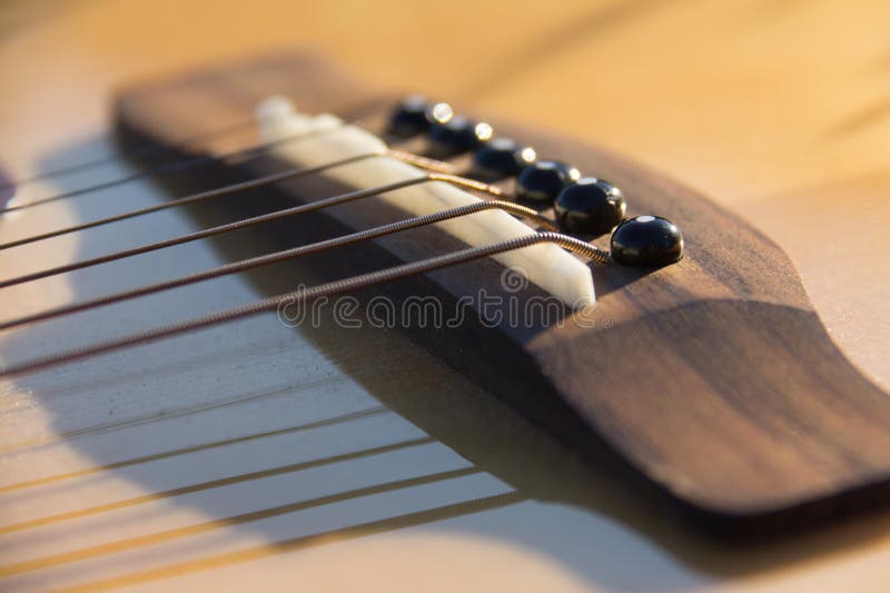 Acoustic Guitar Bridge with Strings and Pin Details Stock Image - Image ...