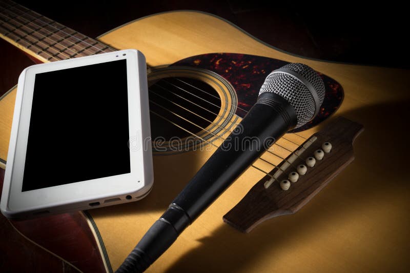 Acoustic Guitar with Microphone and Computer Tablet. Stock Image ...