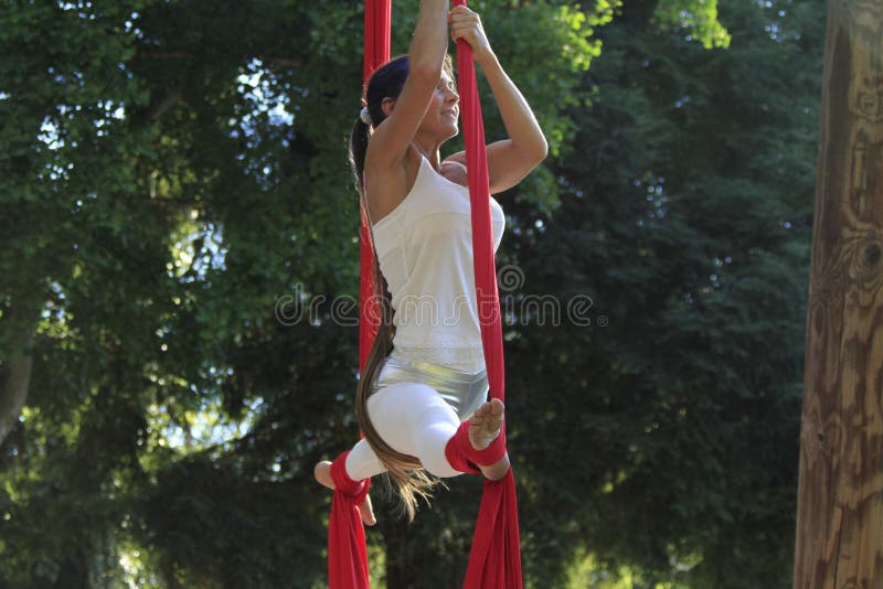 Acrobat Doing Gymnastics, a Young Athlete in a White and Blue Suit ...