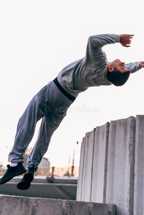 Acrobat Man Training Parkour Exercise while Jumping Backflip Stock ...