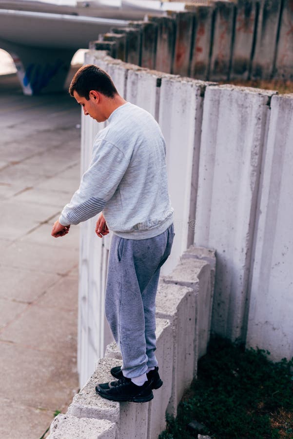 Acrobat Man Training Parkour Exercise while Jumping Backflip Obstacles ...