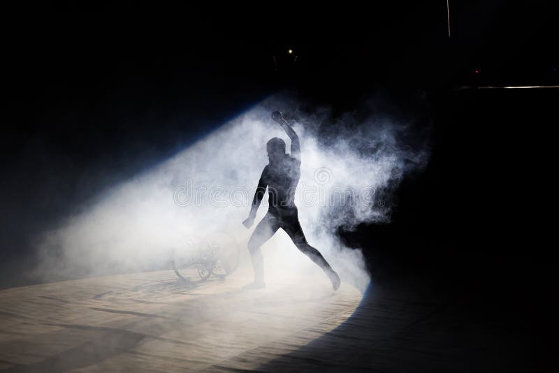 Acrobat Performs a Difficult Trick in the Circus. Stock Photo - Image ...