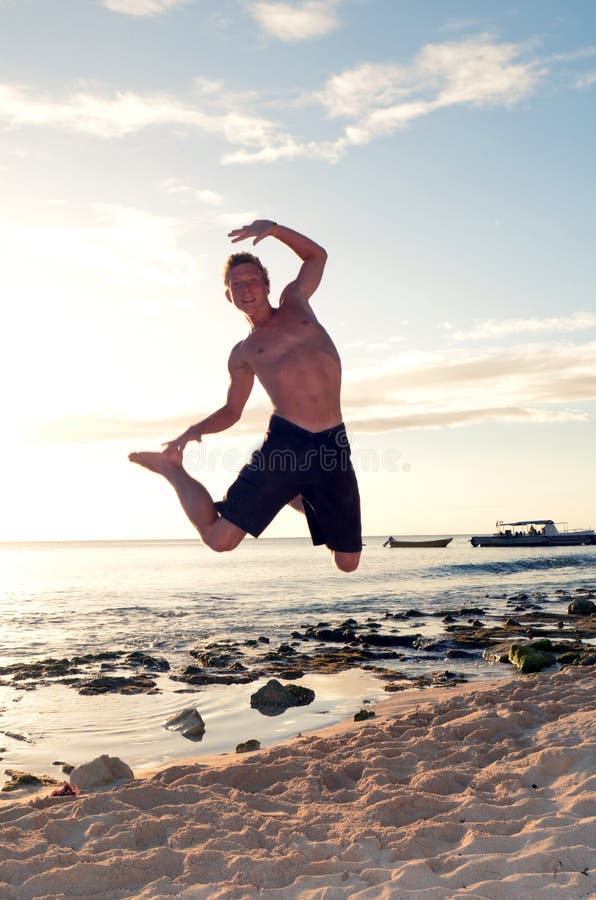 High jumping on beach stock image. Image of body, color - 31604859