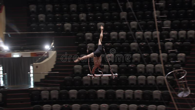 Acrobatic Man Flying Around on Construction for Performance without ...
