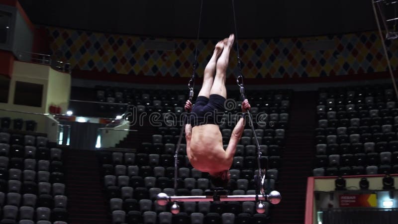 Acrobatic Man Flying Around on Construction for Performance without ...