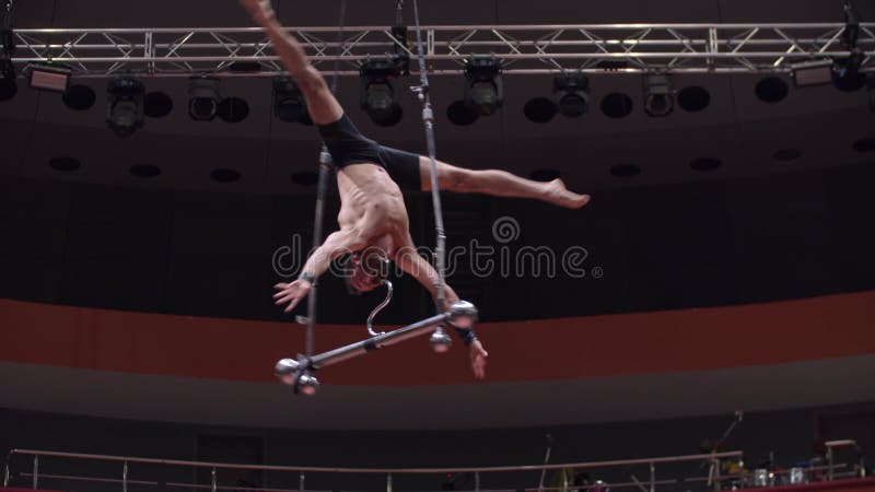 Training in Circus - a Man Standing Upside Down without Hands and Legs ...