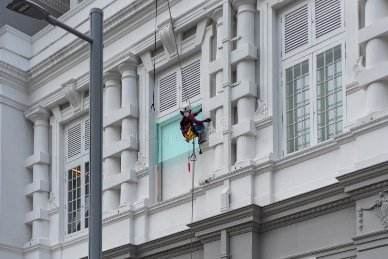 Acrobatic Mayson at Work Harnessed on a Building Stock Photo - Image of ...