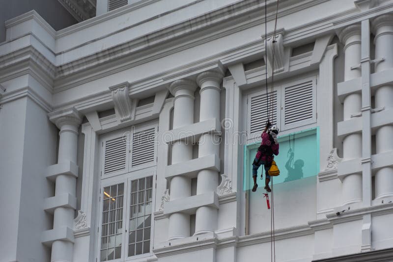 Acrobatic Mayson at Work Harnessed on a Building Stock Photo - Image of ...