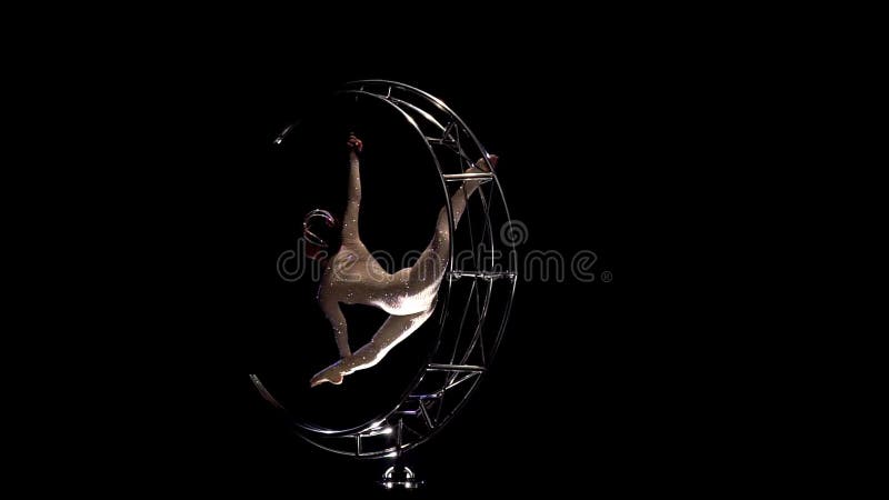 Movement on a Rotating in the Form of a Month Performs Tricks . Black ...