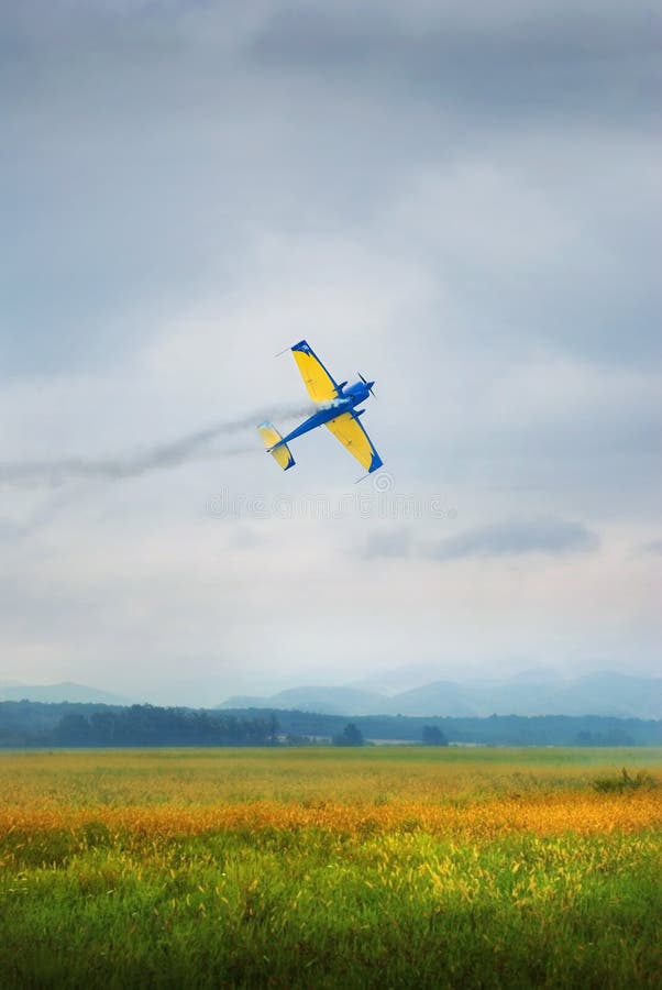 Acrobatic plane flying low stock photo. Image of airshow - 34660090