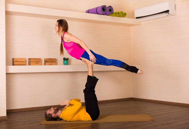 Acrobatic yoga in a studio stock photo. Image of life - 86079336