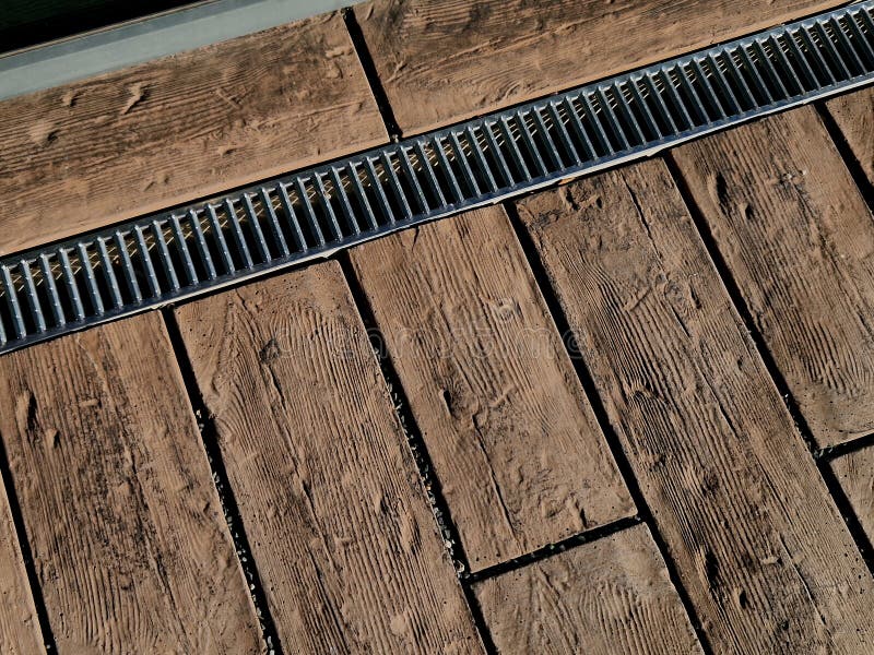 Across the Path There is a Channel with a Metal Grid for Drainage ...