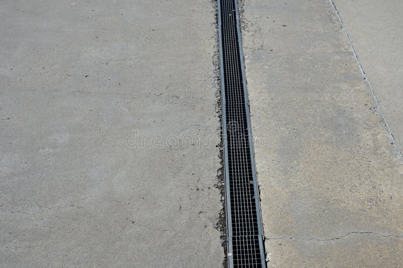 Across the Path There is a Channel with a Metal Grid for Drainage ...