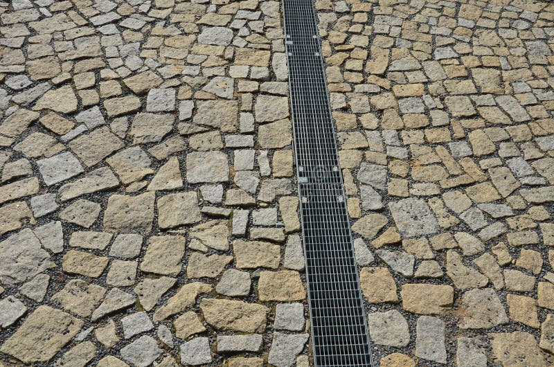 Across the Path There is a Channel with a Metal Grid for Drainage ...