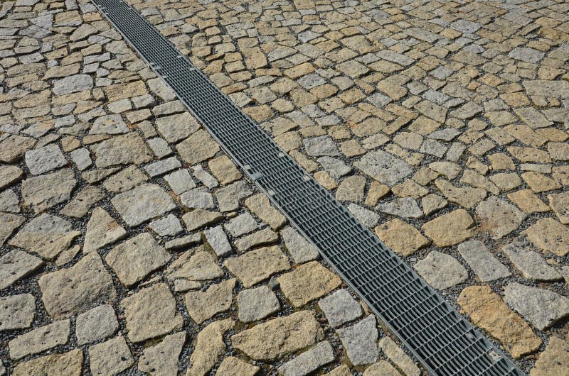Across the Path There is a Channel with a Metal Grid for Drainage ...