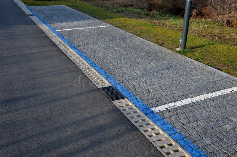 Across the Path There is a Channel with a Metal Grid for Drainage ...