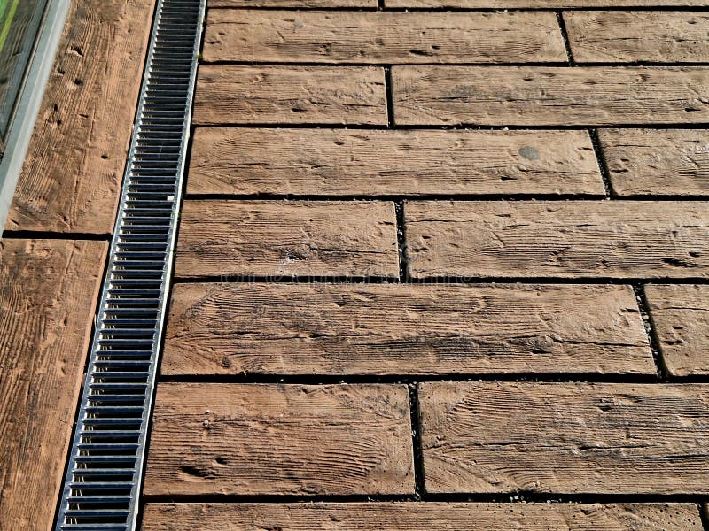 Across the Path There is a Channel with a Metal Grid for Drainage ...