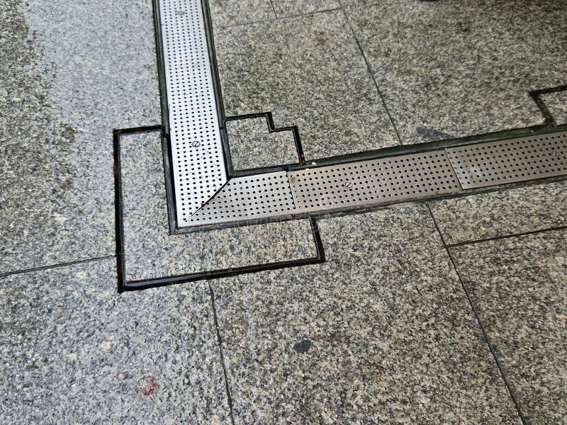 Across the Path There is a Channel with a Metal Grid for Drainage ...